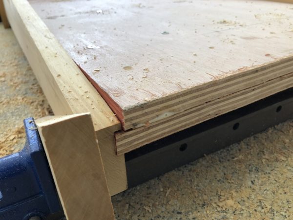 Double plywood, and the 1/4 inch recessed groove for top layer ...
